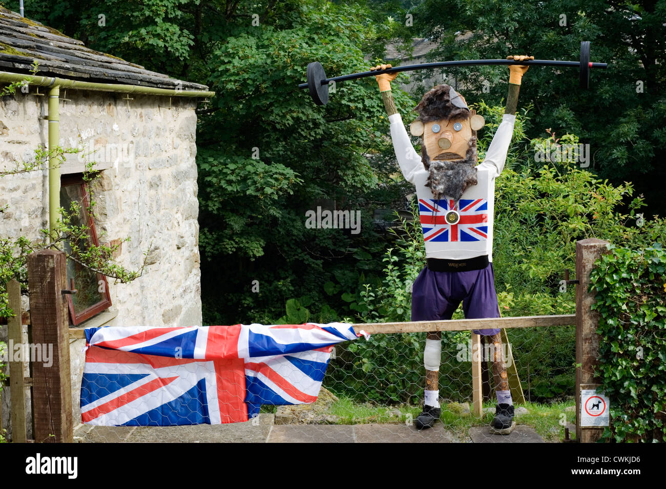 scarecrow at kettlewell festival depicting a weight lifter at the ...