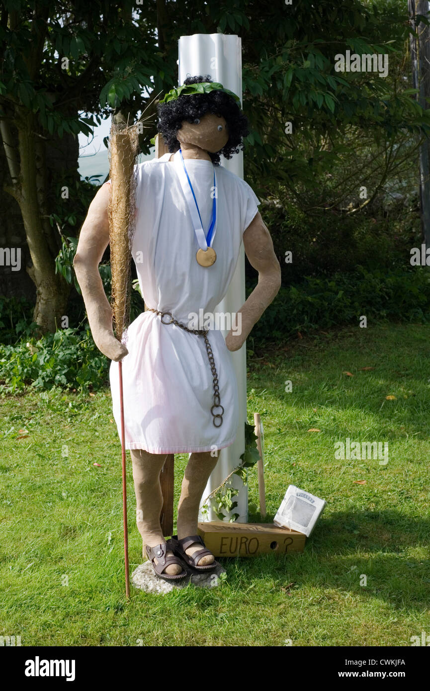 scarecrow at kettlewell festival depicting a torch bearer for the ...