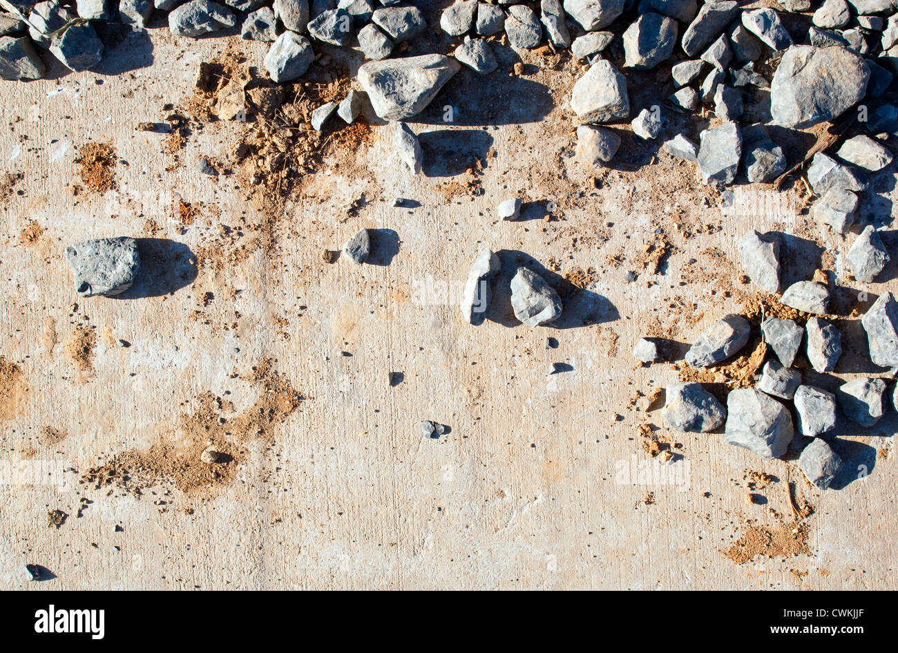 Rocks and mud over concrete on a building construction site Stock Photo ...