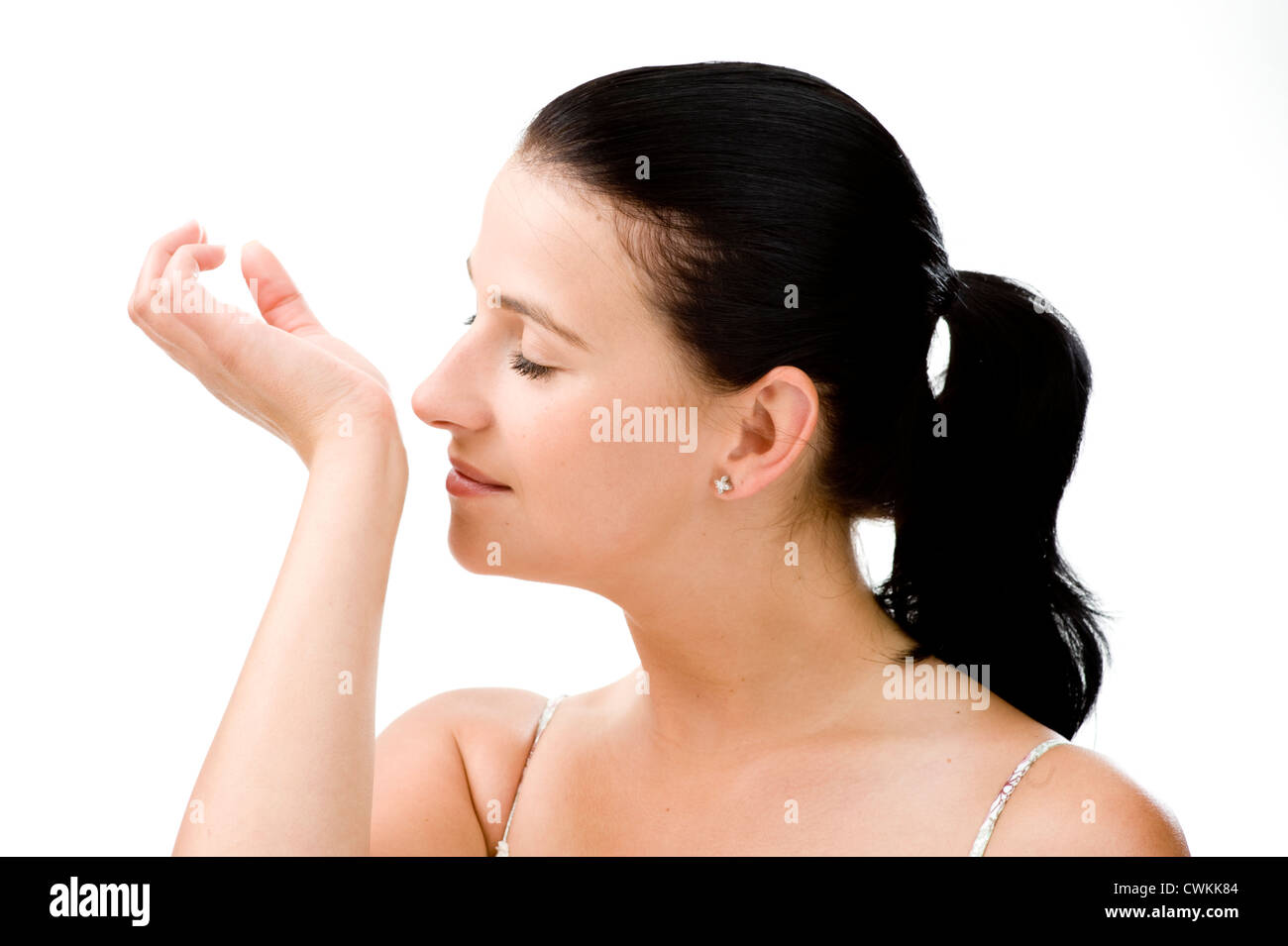 Smelling a Perfume Stock Photo - Alamy