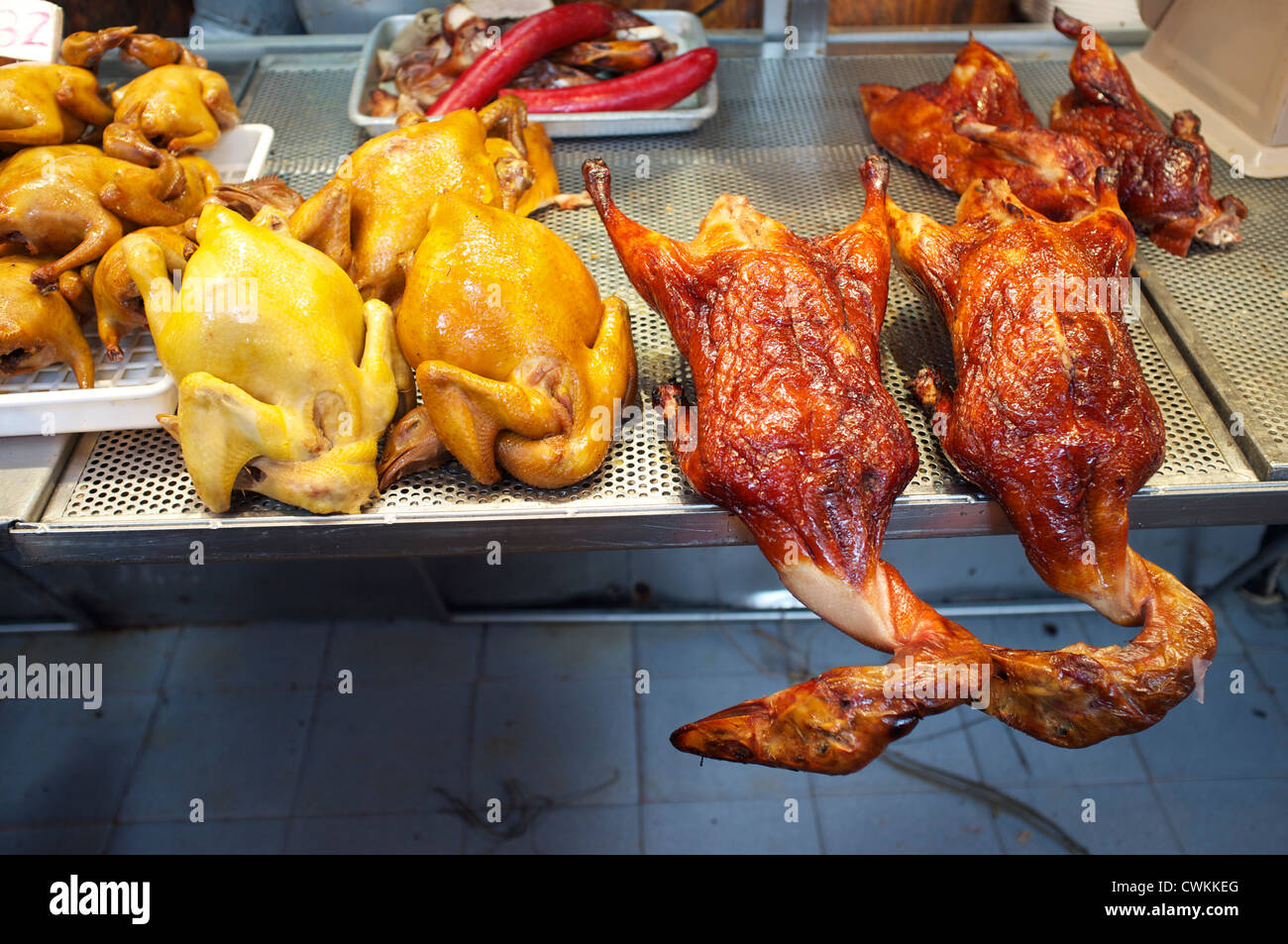 Cooked chickens and gooses are on sale in a market in Hong Kong. 27-Aug ...