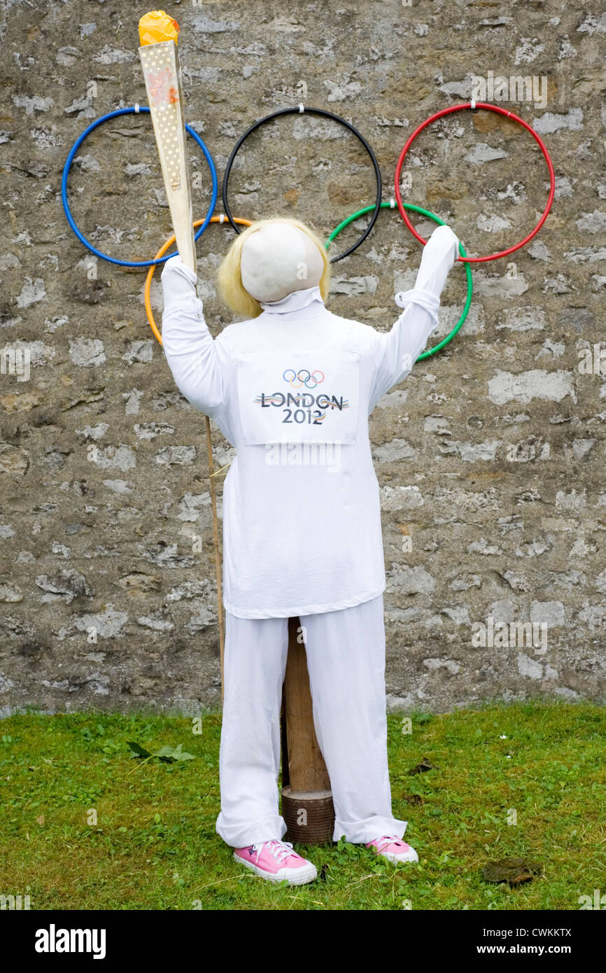 scarecrow at kettlewell festival depicting a torch carrier and the ...