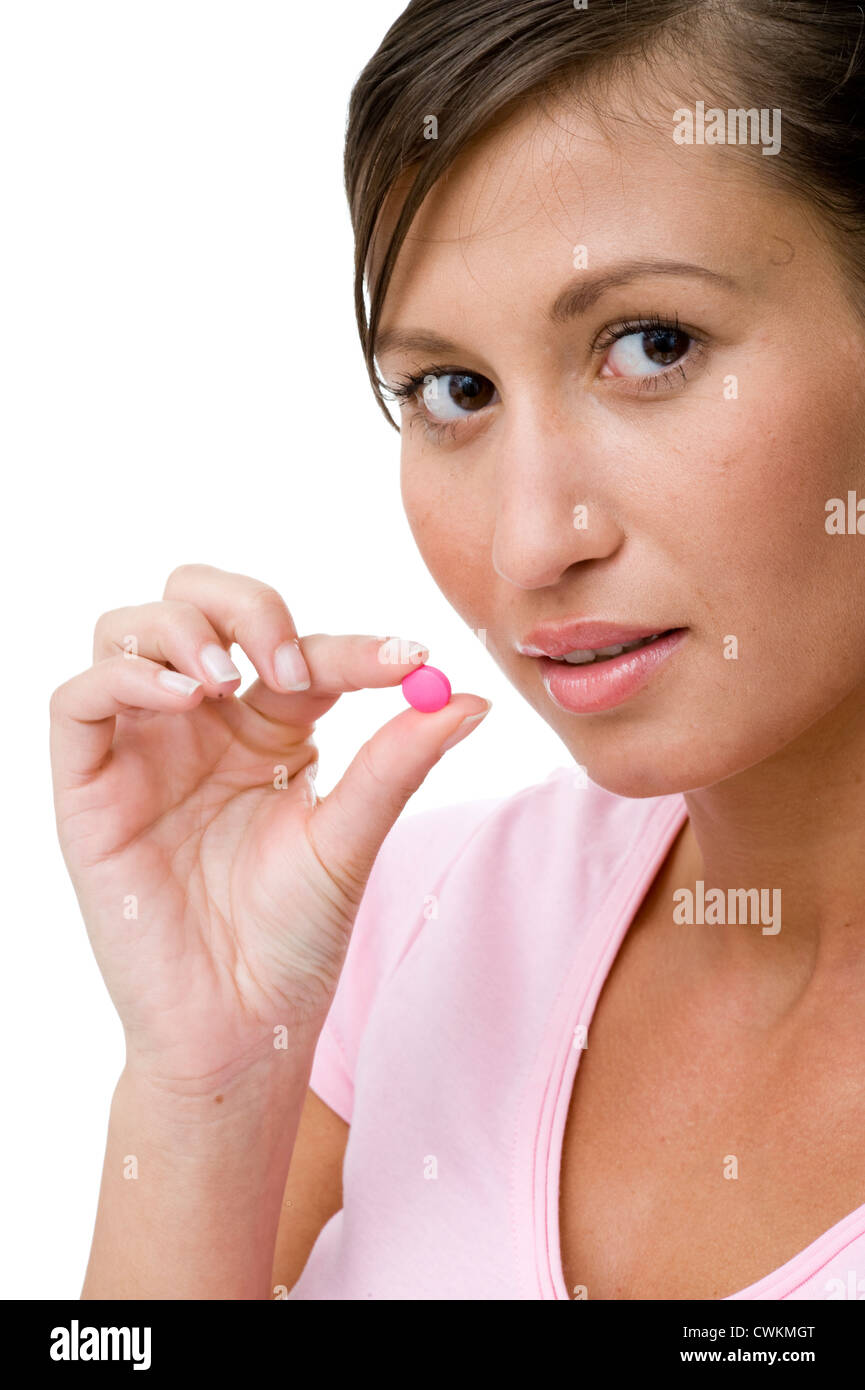 Young Woman Taking a Pill Stock Photo - Alamy