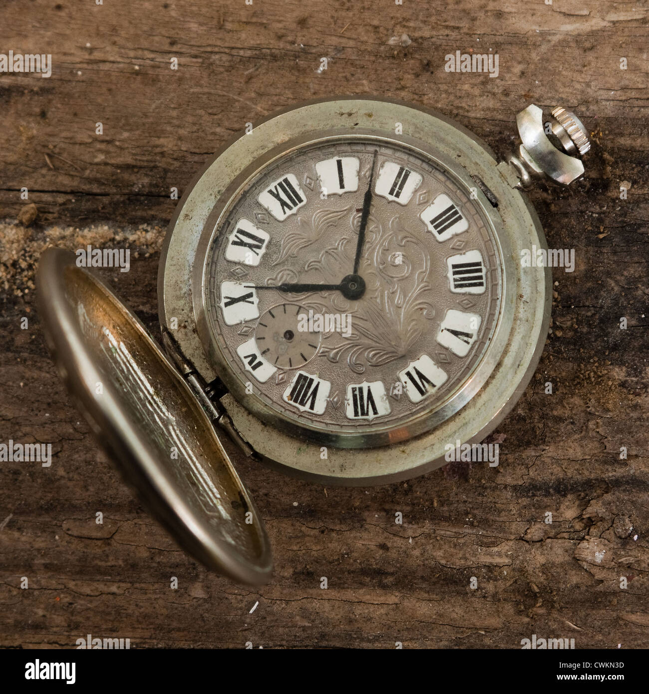 antique pocket watch on a wooden background Stock Photo - Alamy
