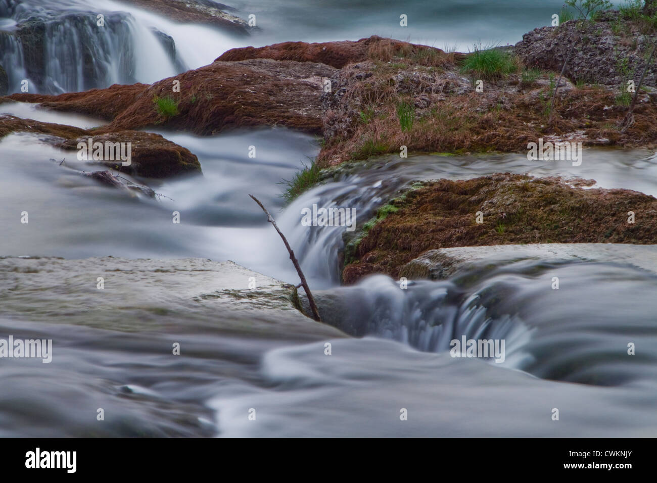 water falling over a rock, waterfall long exposure Stock Photo - Alamy