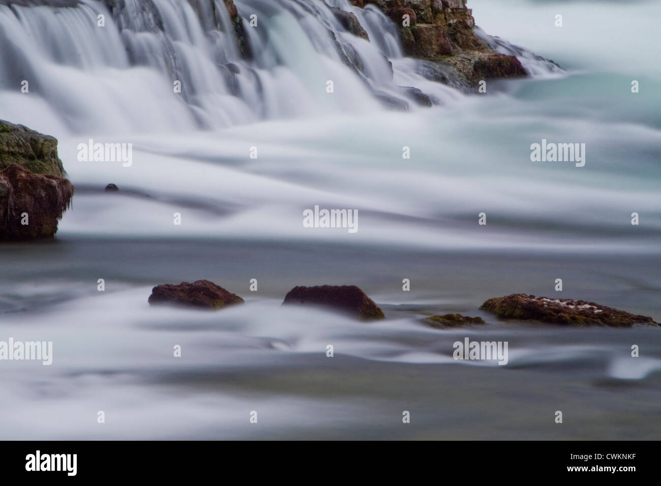 water falling over a rock, waterfall long exposure Stock Photo - Alamy