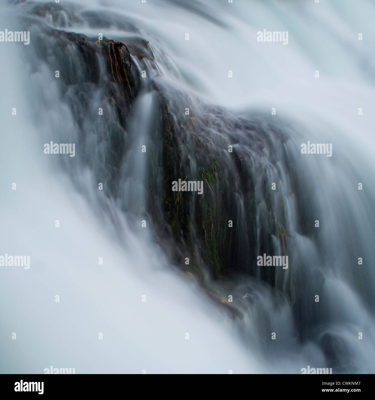 water falling over a rock, waterfall long exposure Stock Photo - Alamy