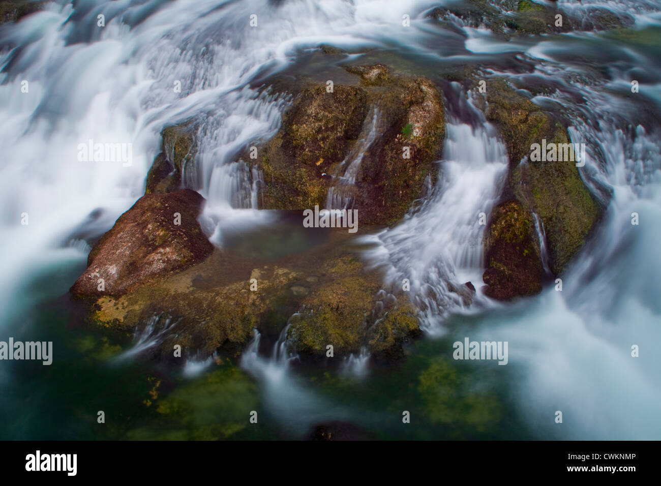 water falling over a rock, waterfall long exposure Stock Photo - Alamy