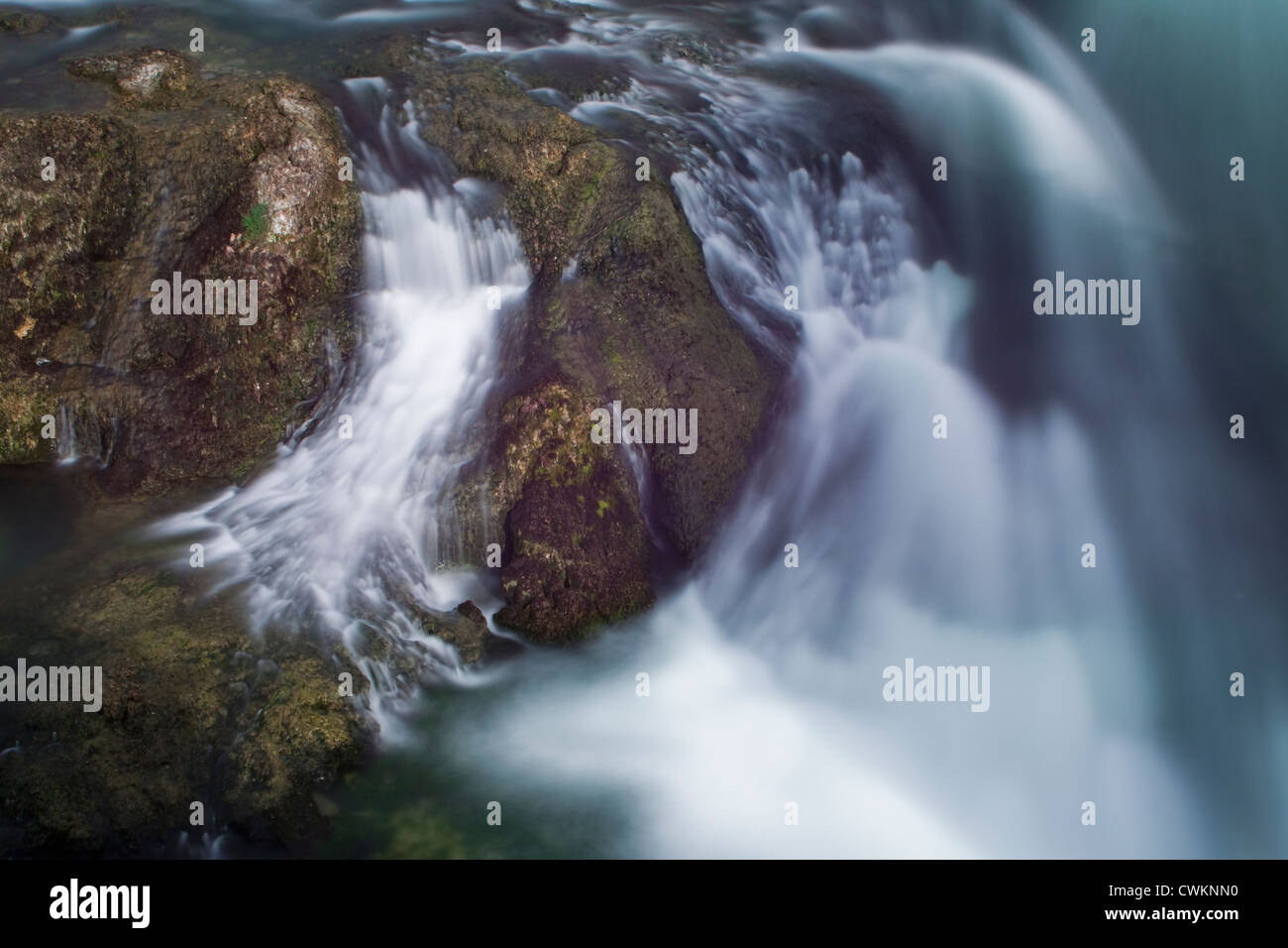water falling over a rock, waterfall long exposure Stock Photo - Alamy