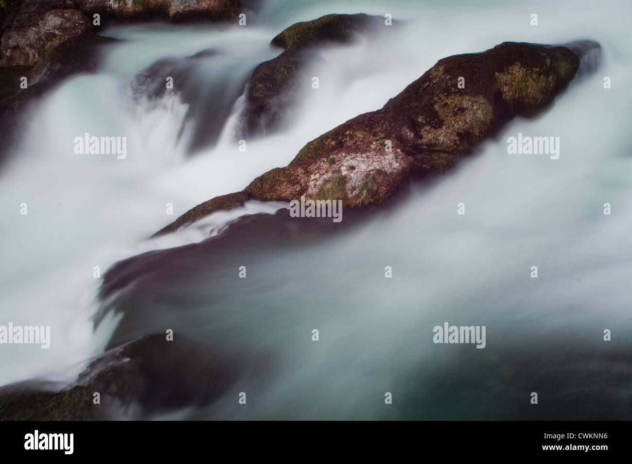 water falling over a rock, waterfall long exposure Stock Photo - Alamy