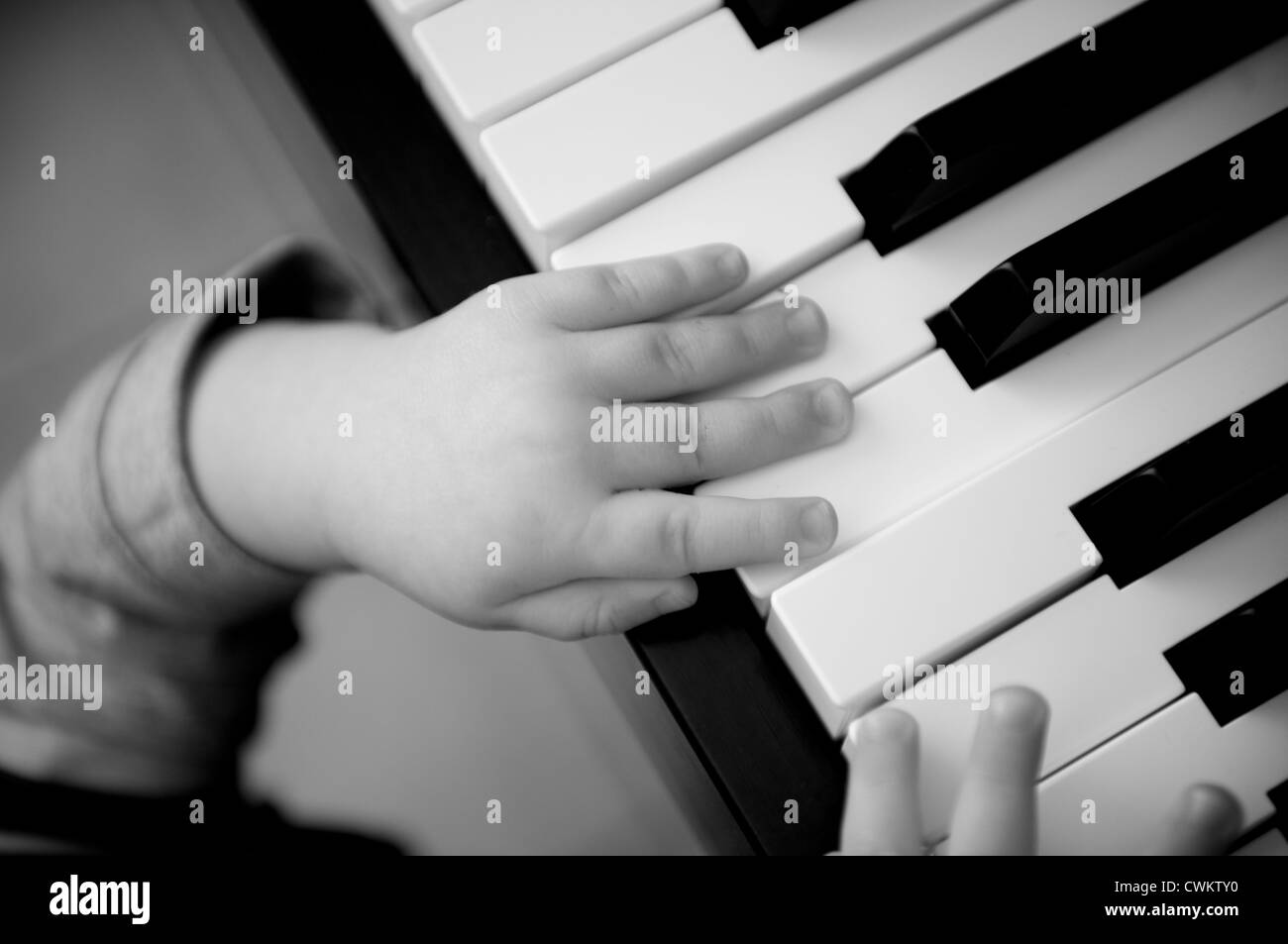 A young child exploring music Stock Photo - Alamy