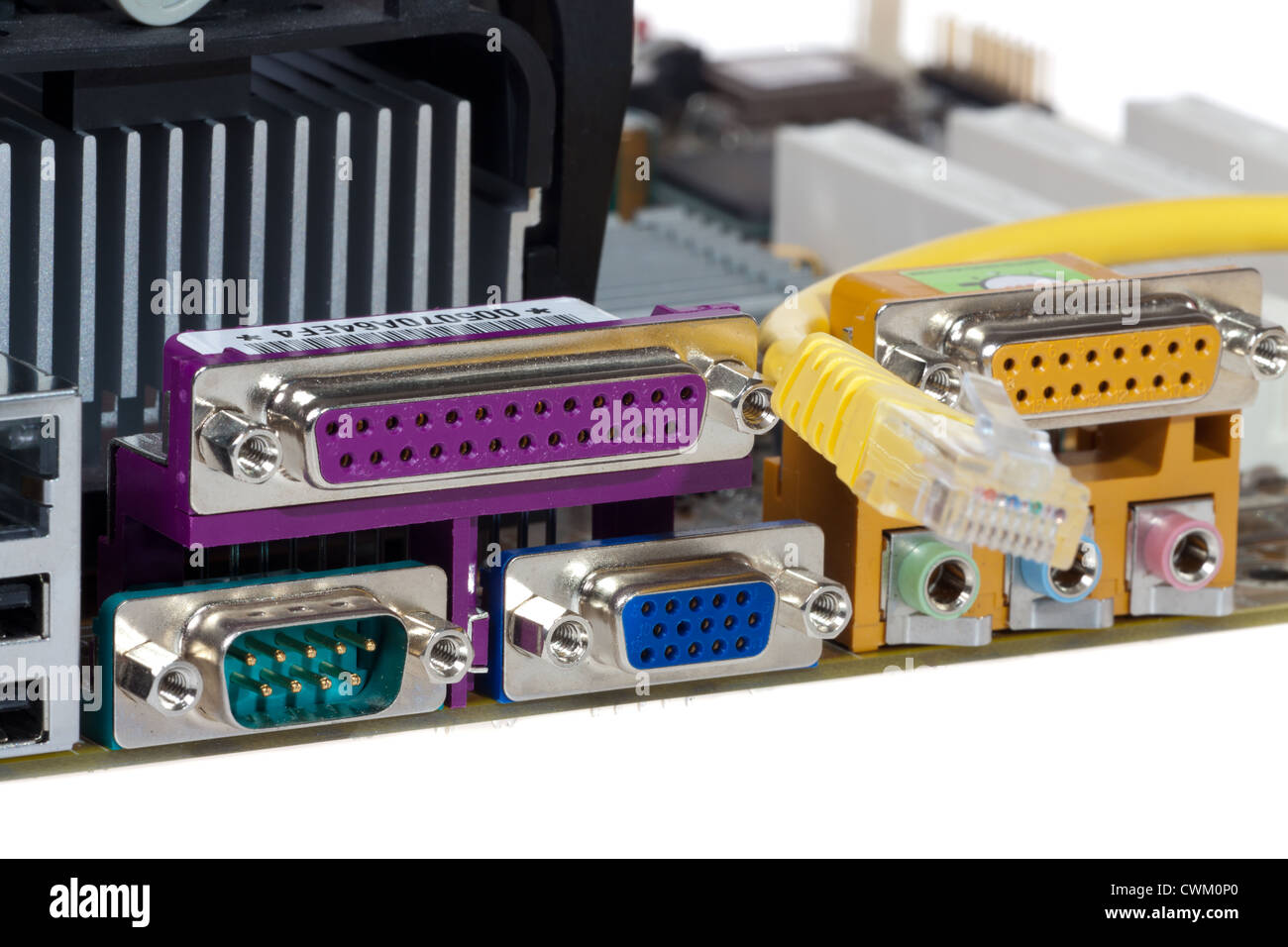 Yellow Network cable is on an isolated on a motherboard on a white ...