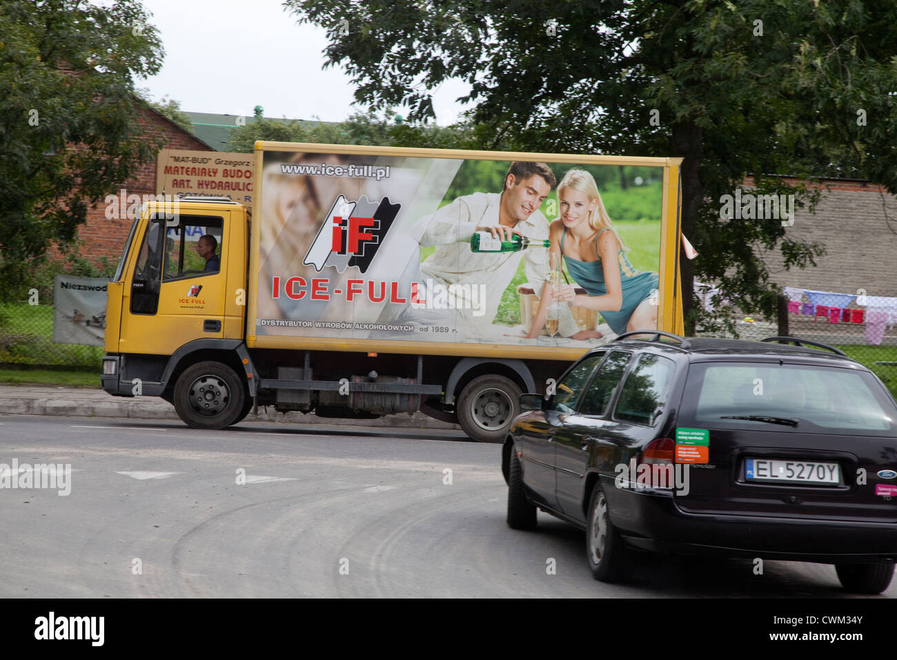 Alcohol delivery truck with full size picture of attractive couple ...