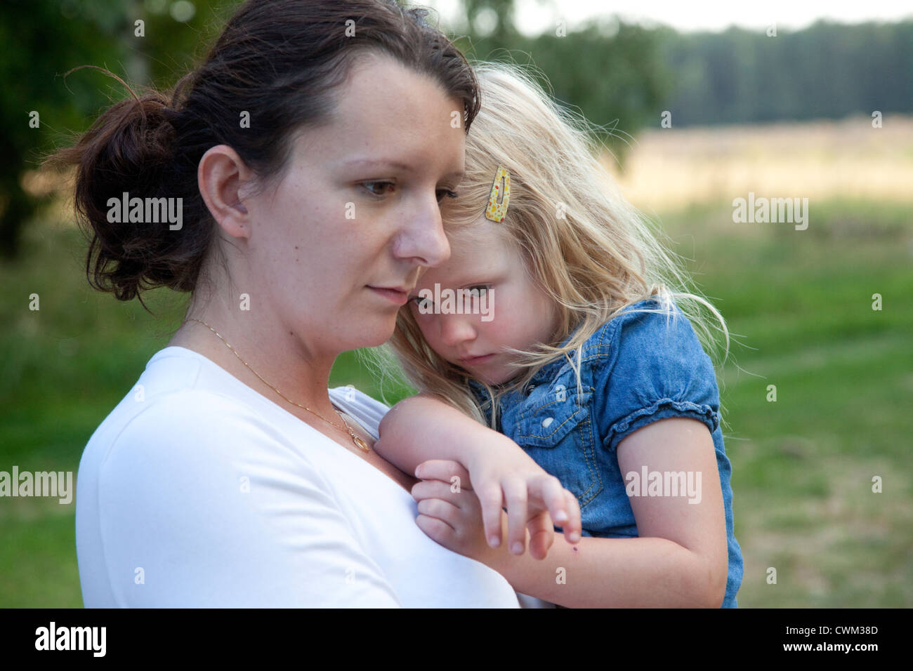Polish mom having a somber moment holding her daughter age 32 and 4 ...