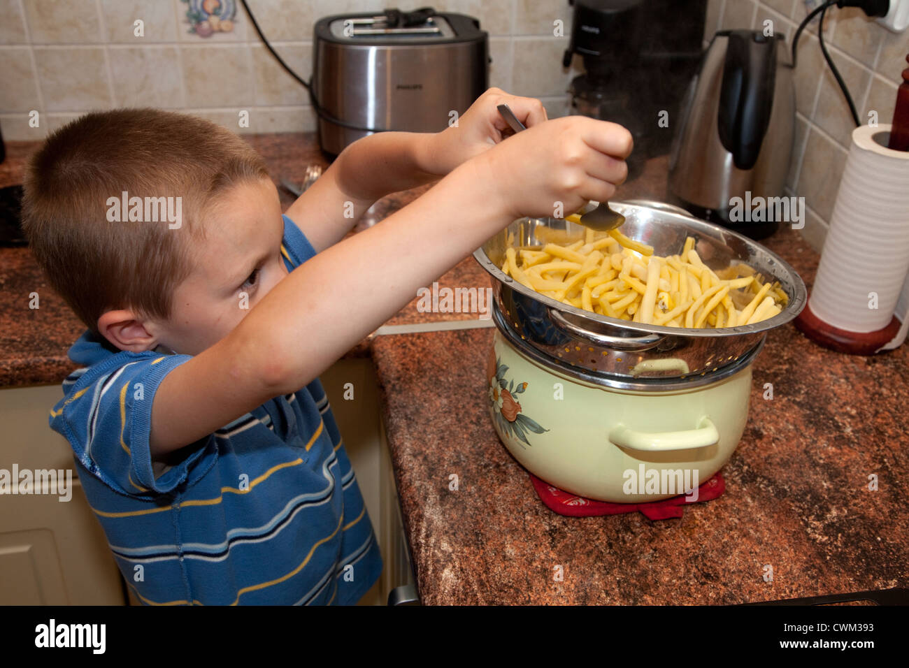 Boy eating beans hi-res stock photography and images - Alamy