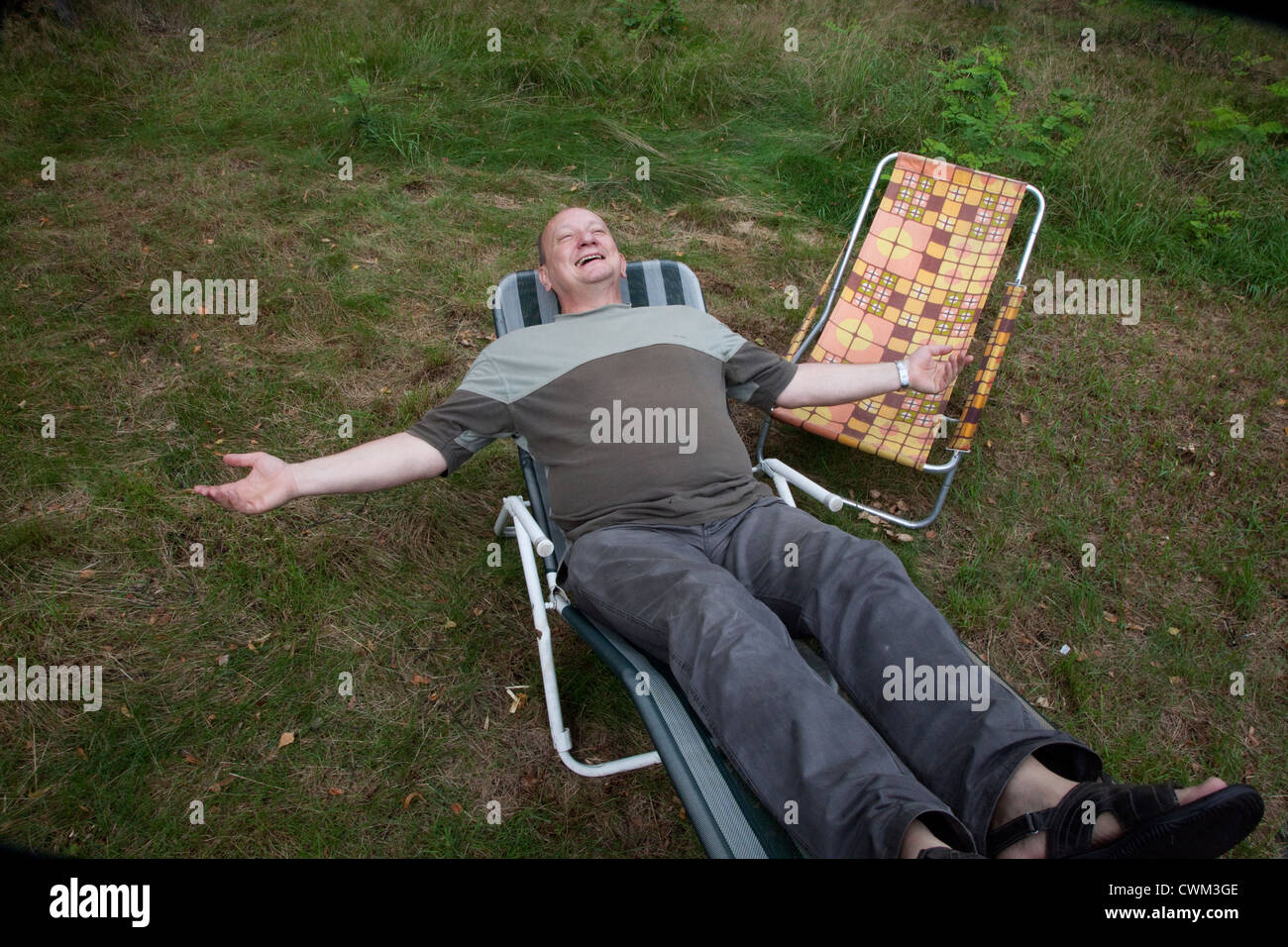 Polish man age 58 enjoying a well deserved rest on a lawn chair. Zawady ...