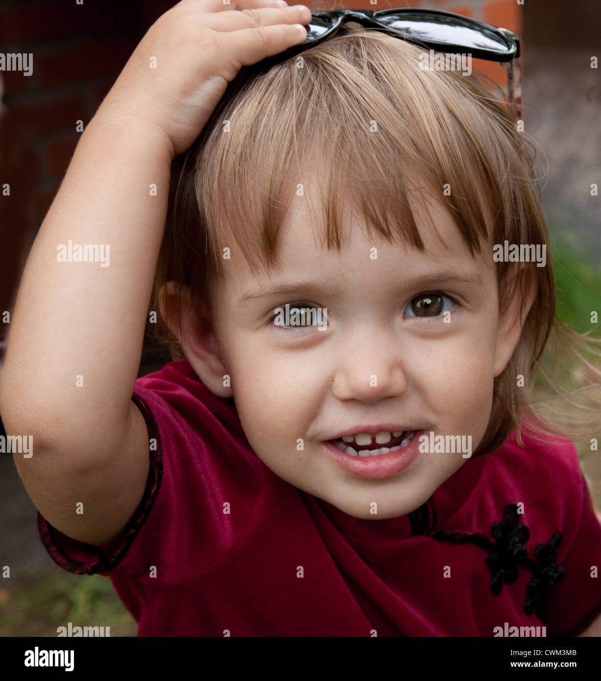 Cute little Polish girl age 2 wearing mom's sun glasses on top of her ...
