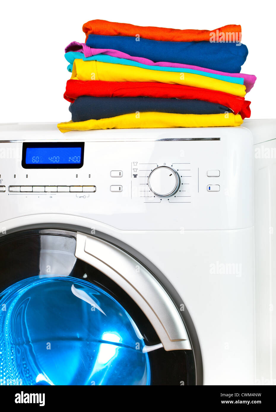 Pile of colorful clothes on the washing machine Stock Photo - Alamy