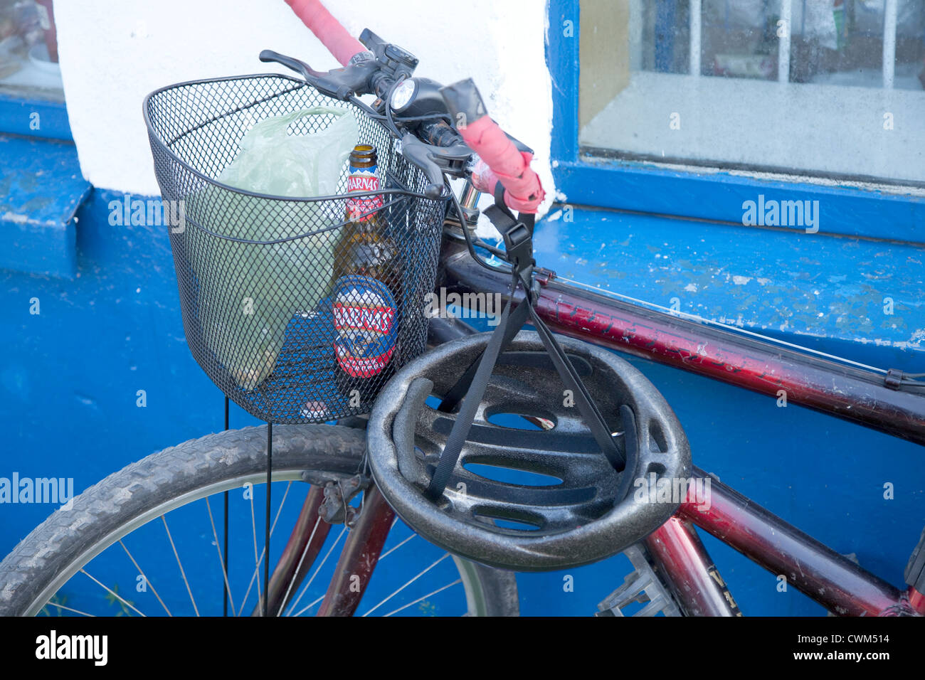 Bicycle with beer in basket and helmet after a long bike ride. Mala ...