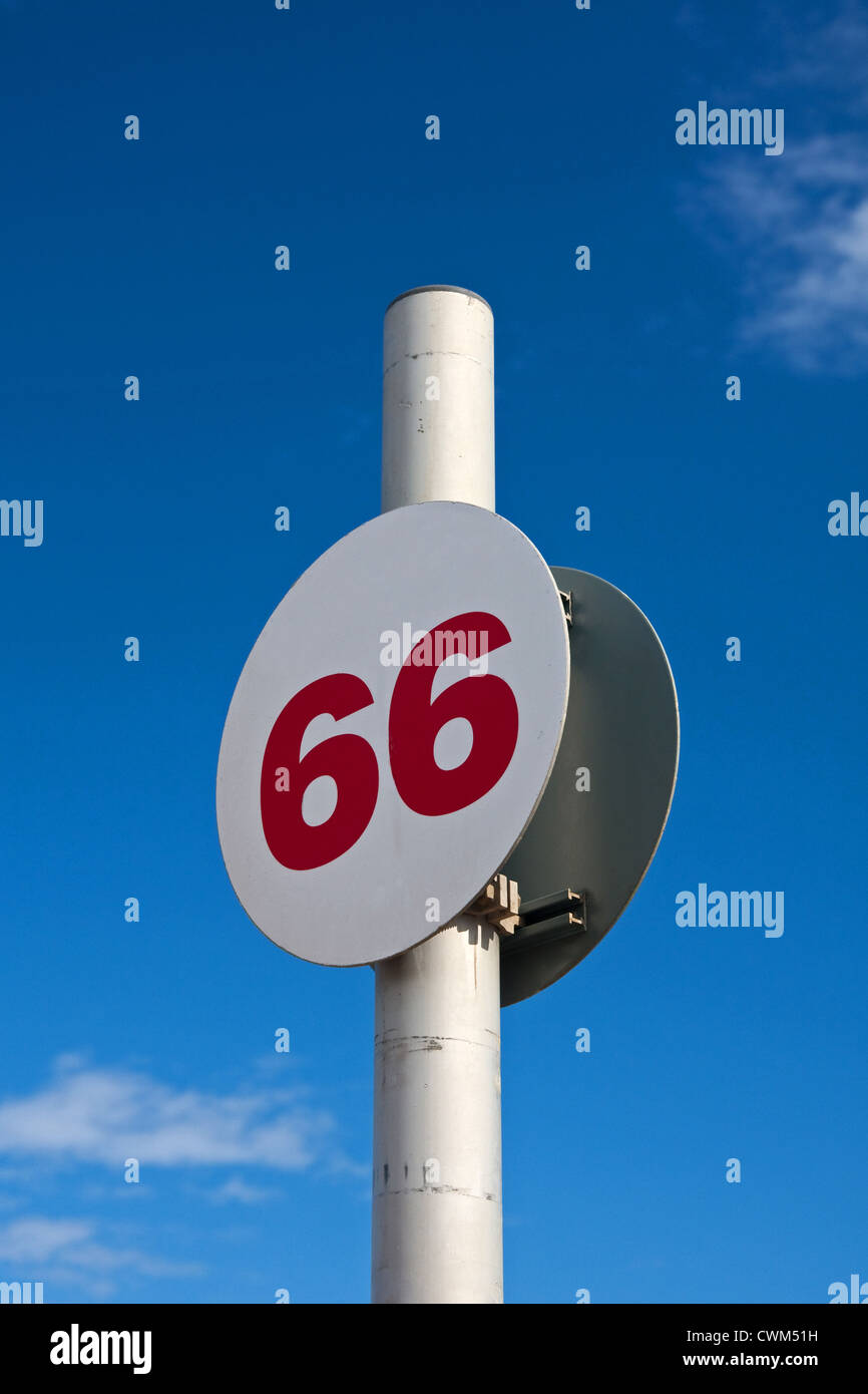 White sign with red 66 against blue sky Stock Photo - Alamy
