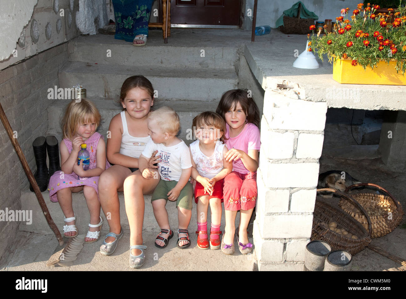 Polish children sitting on farm house steps ages 8 thru 2. Zawady ...