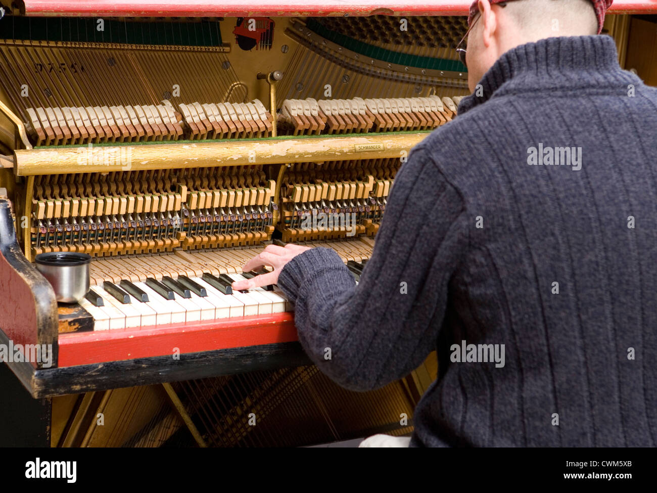 Man playing an open top piano outside York minster Stock Photo - Alamy