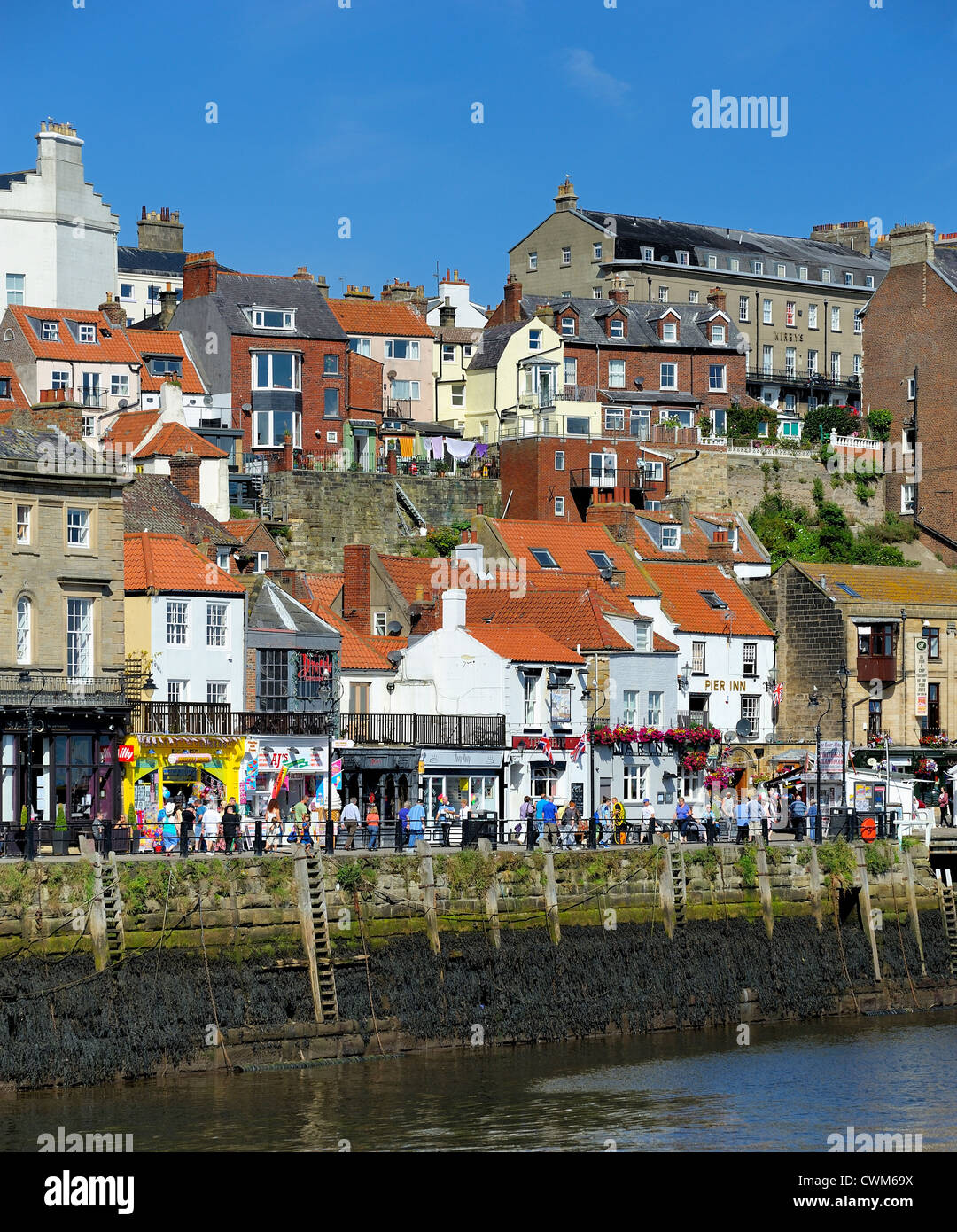 whitby town and harbour wall north yorkshire england uk Stock Photo - Alamy