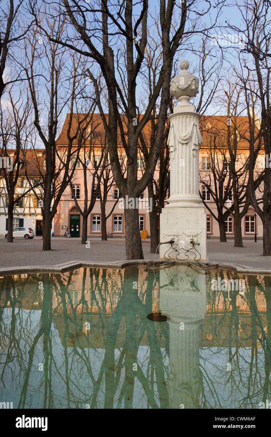 Fountain reflection in Muensterplatz (Munster square) in Basel ...