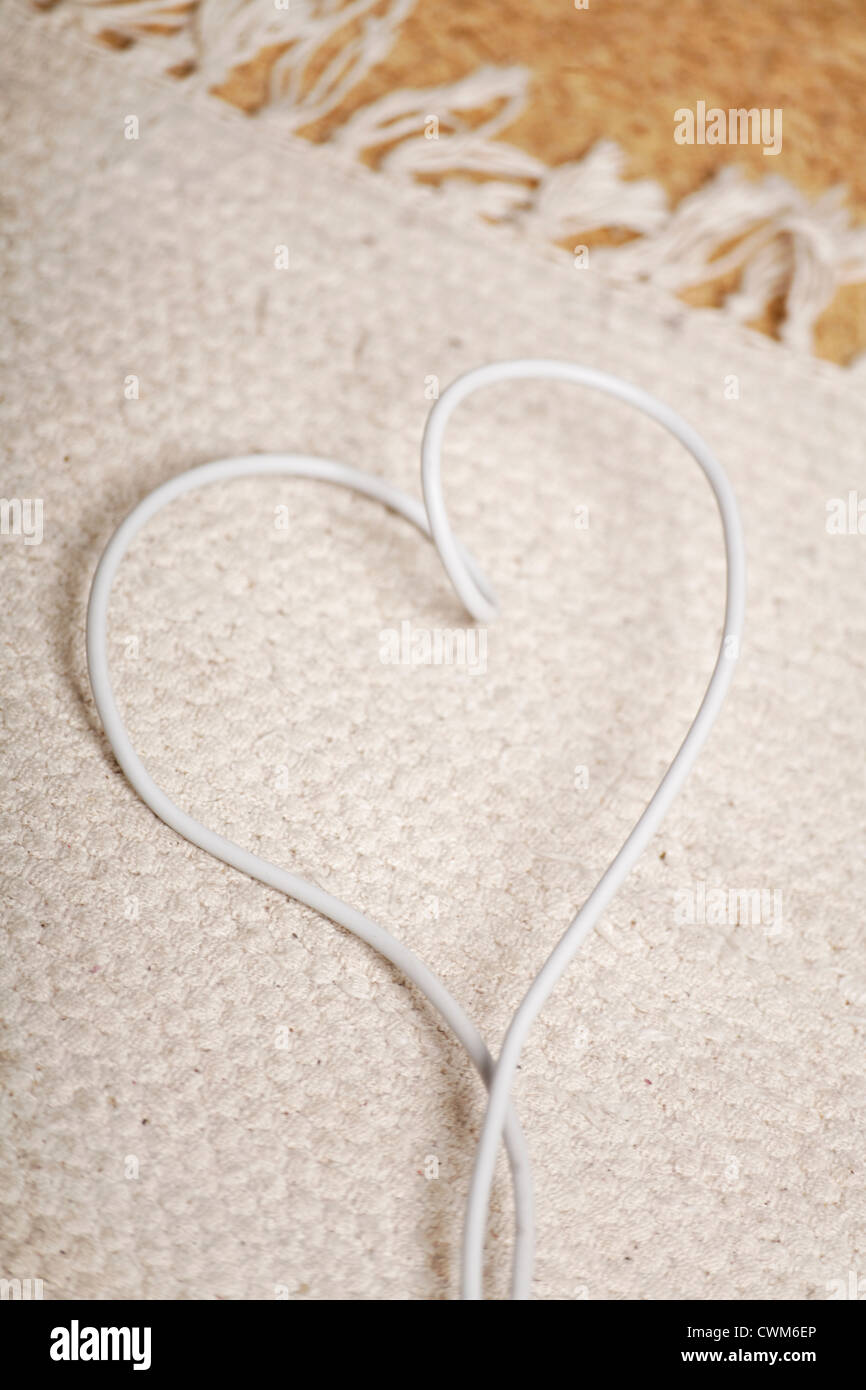 Germany, Heart shape cable on mat Stock Photo - Alamy