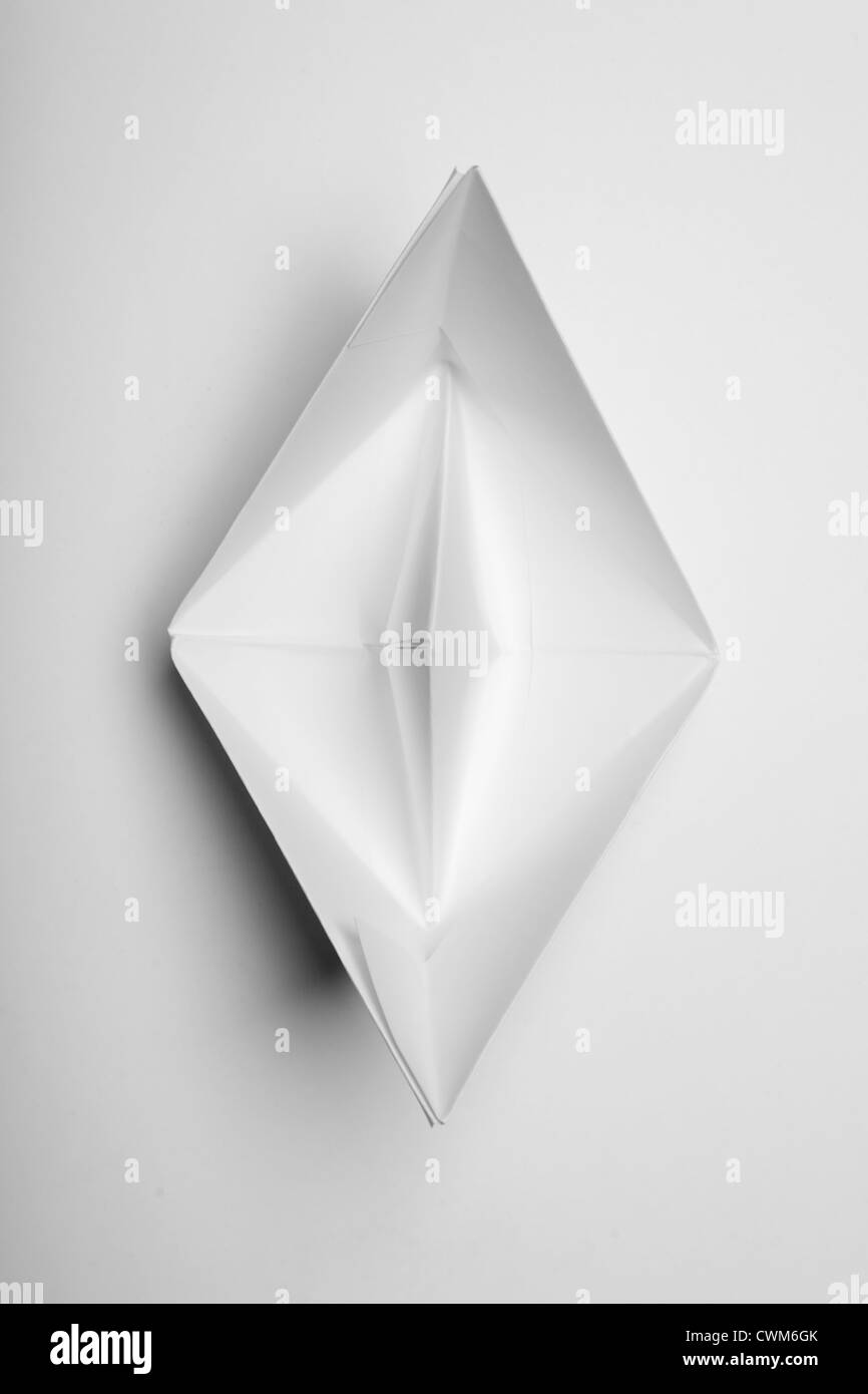 Paper boat on white background Stock Photo - Alamy