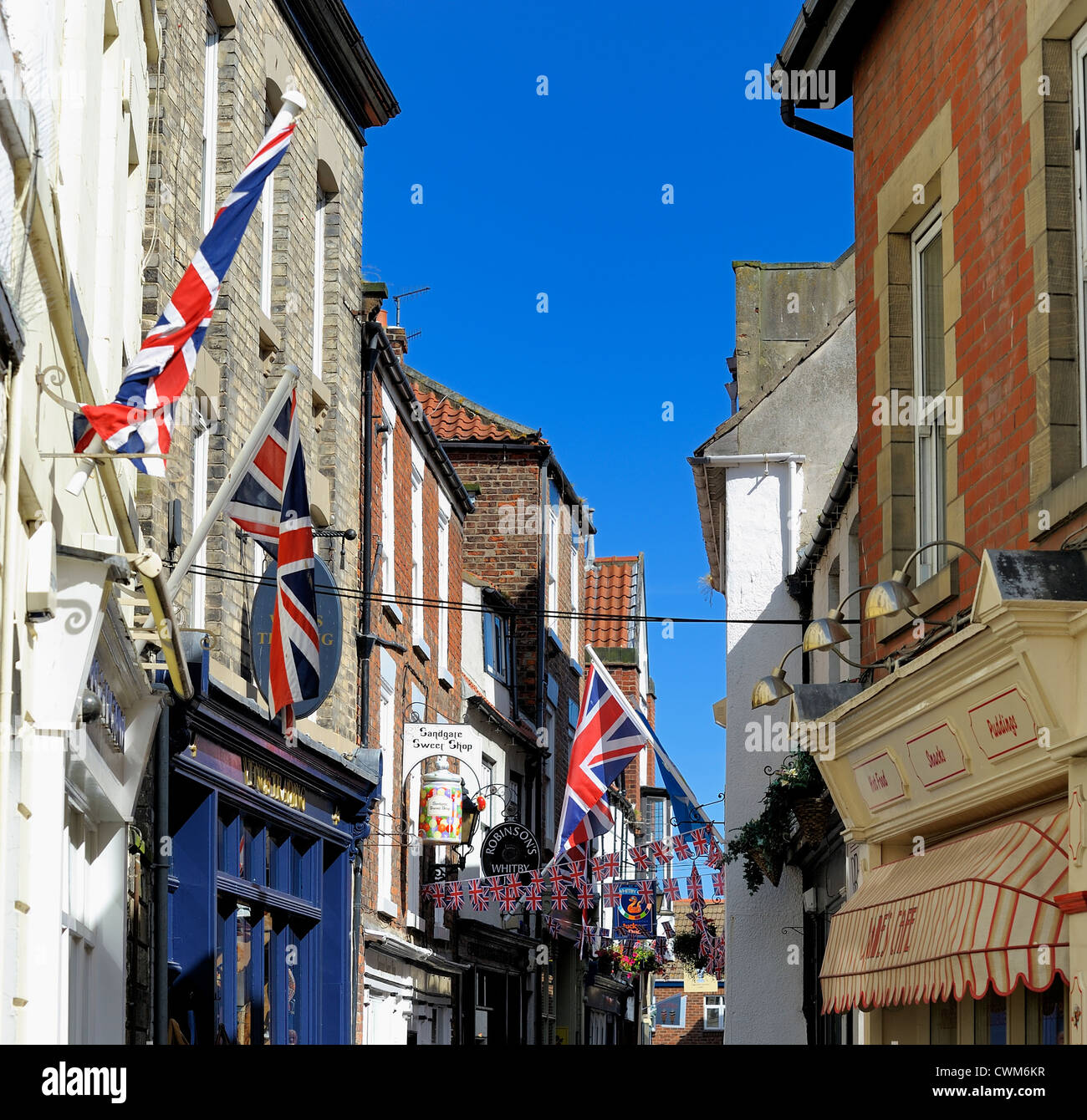 sandgate shops flags whitby north yorkshire england uk Stock Photo - Alamy