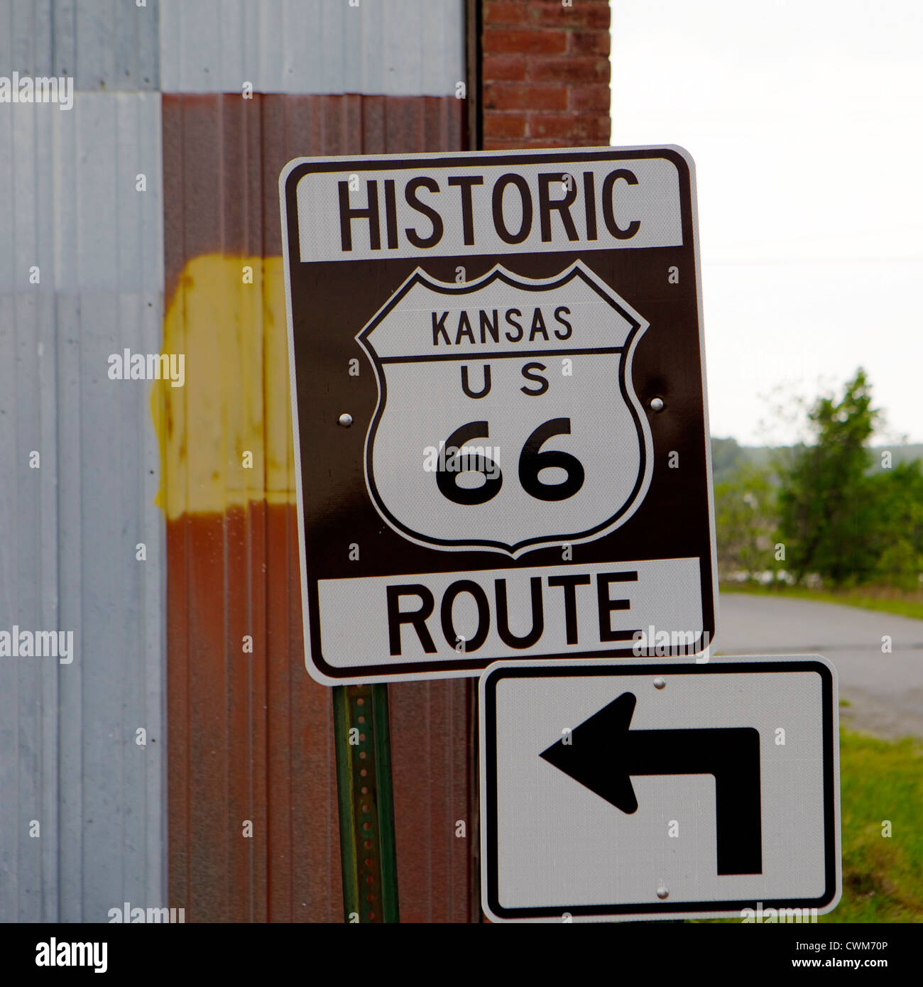 Kansas Route 66 road sign above a left arrow sign Stock Photo - Alamy