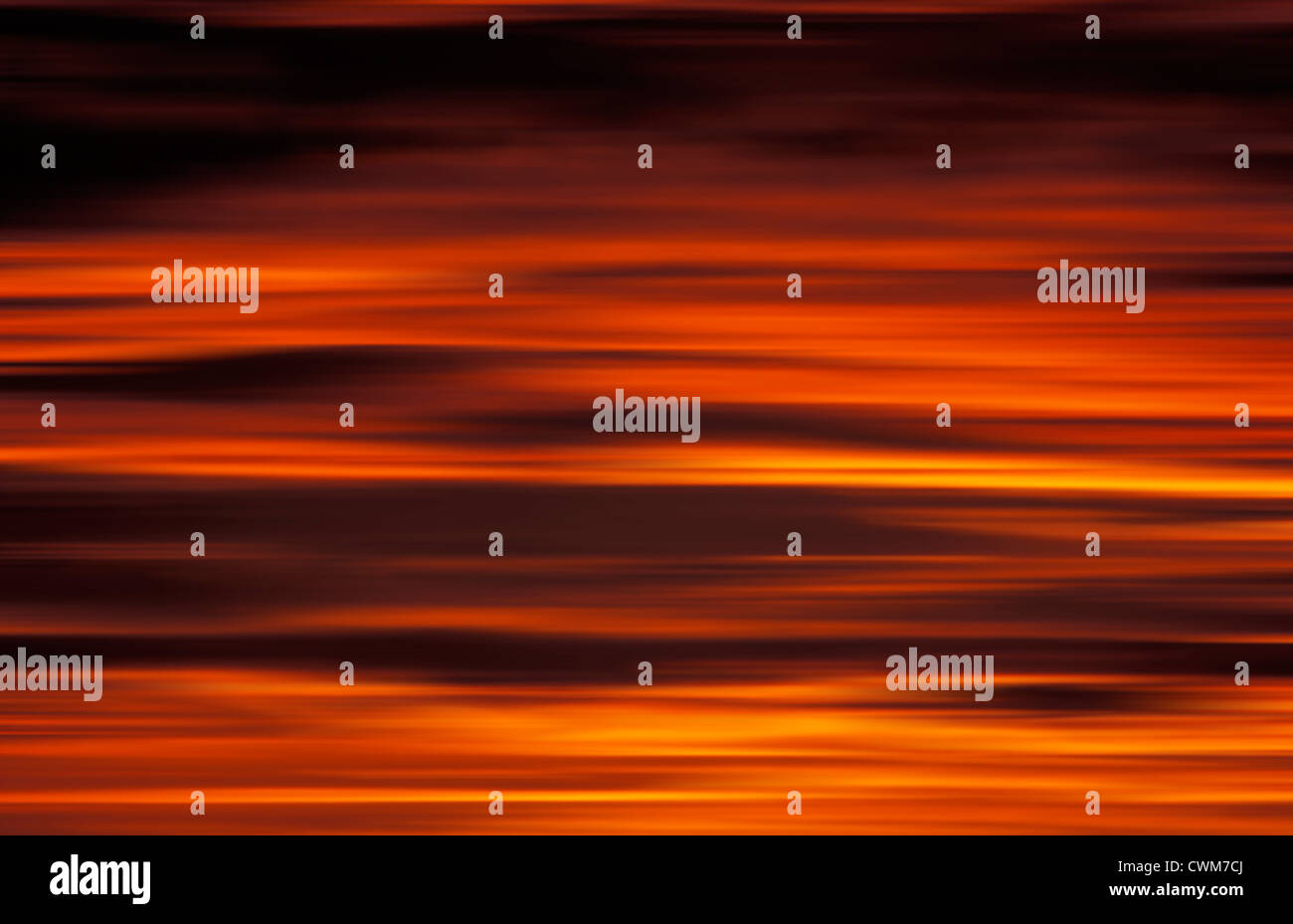 Full frame view of orange and grey dawn sky Stock Photo - Alamy