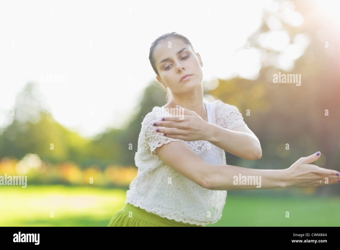 Young woman dancing on meadow Stock Photo - Alamy