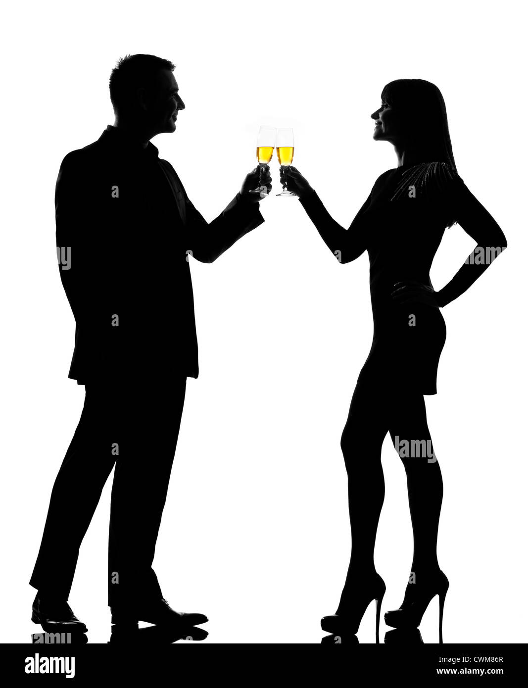one caucasian couple man and woman drinking champagne toasting partying ...