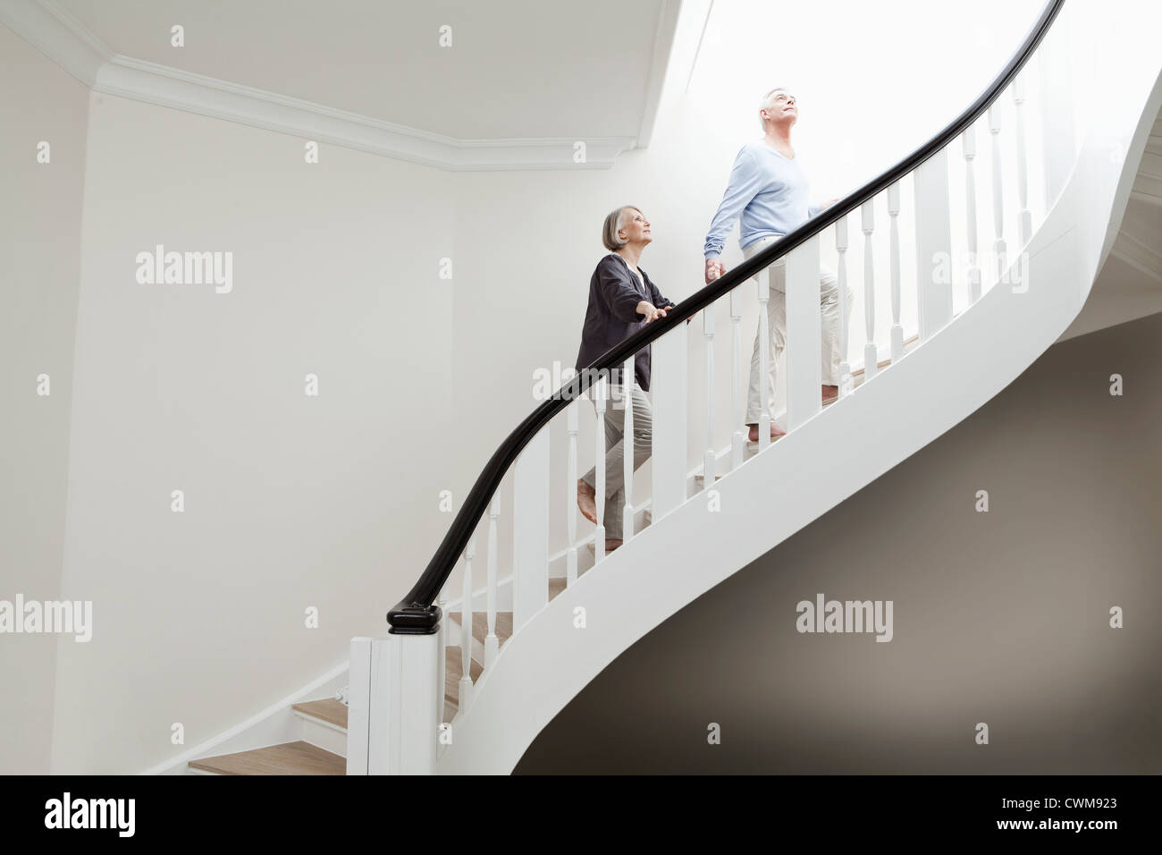 Senior man climbing stairs hi-res stock photography and images - Alamy