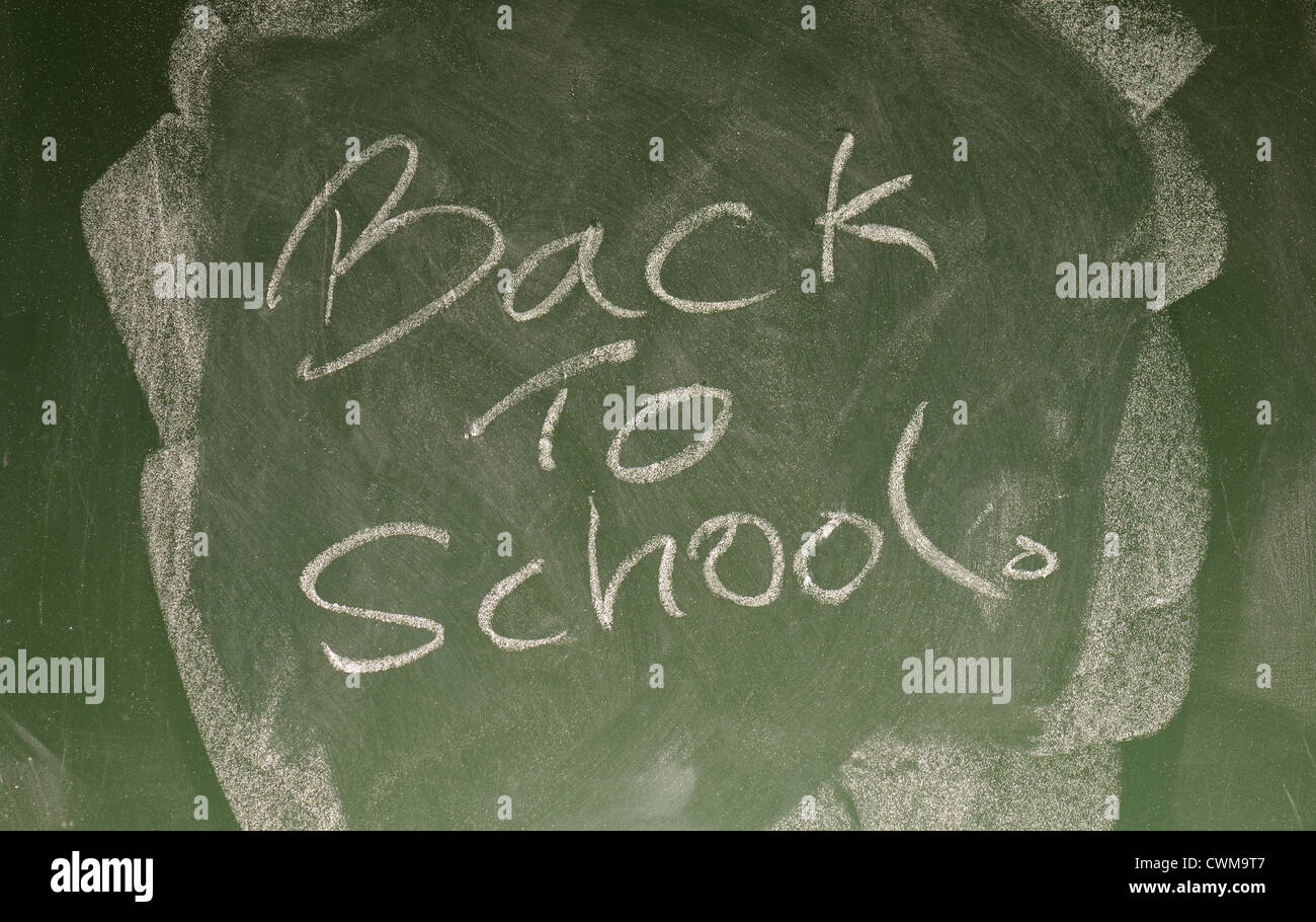 back to school written on a chalk board Stock Photo - Alamy