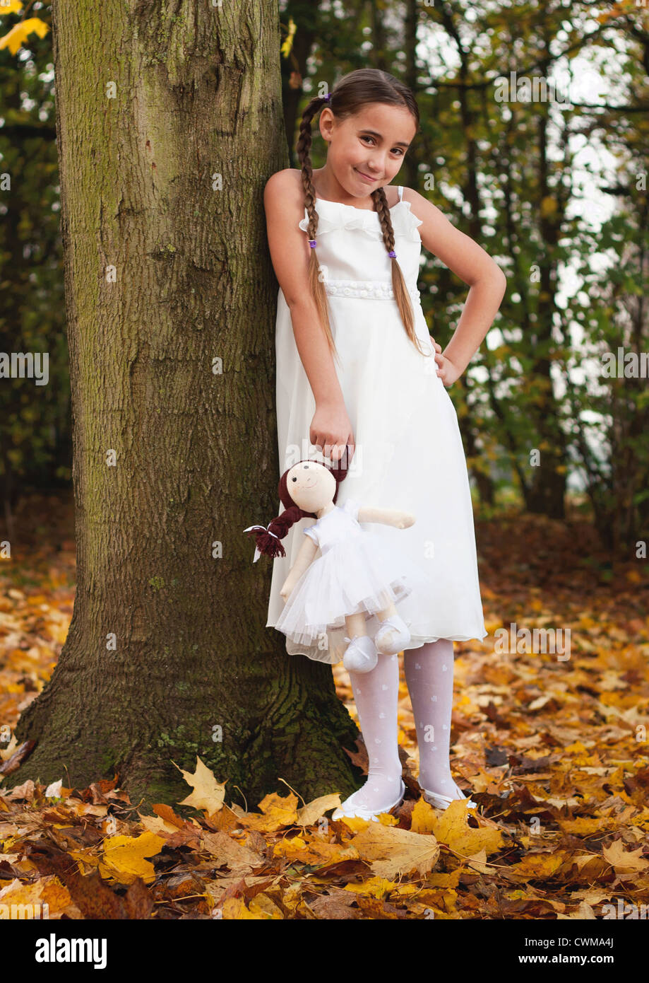 young girl with rag doll in park Stock Photo - Alamy