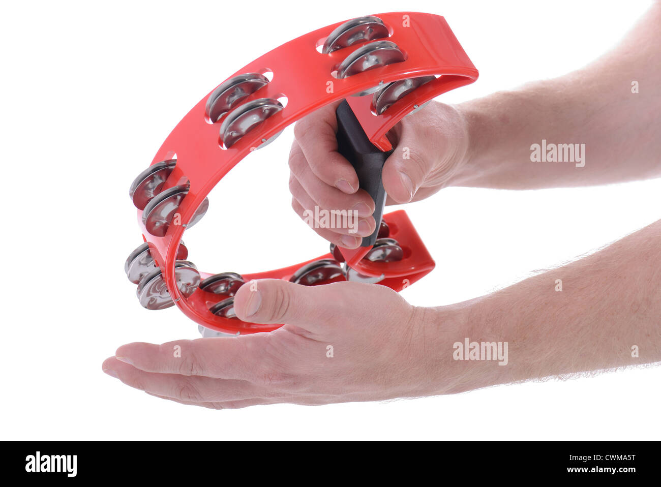 hands playing red musical tambourine on white background Stock Photo ...