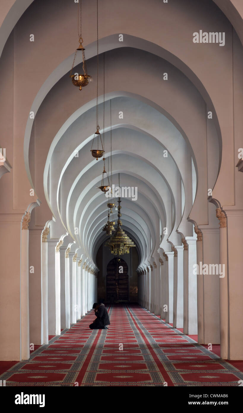 Inside a mosque with muslim man kneeling praying Stock Photo - Alamy