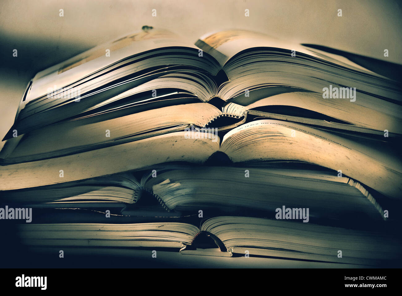 Heap of old books against white background Stock Photo - Alamy