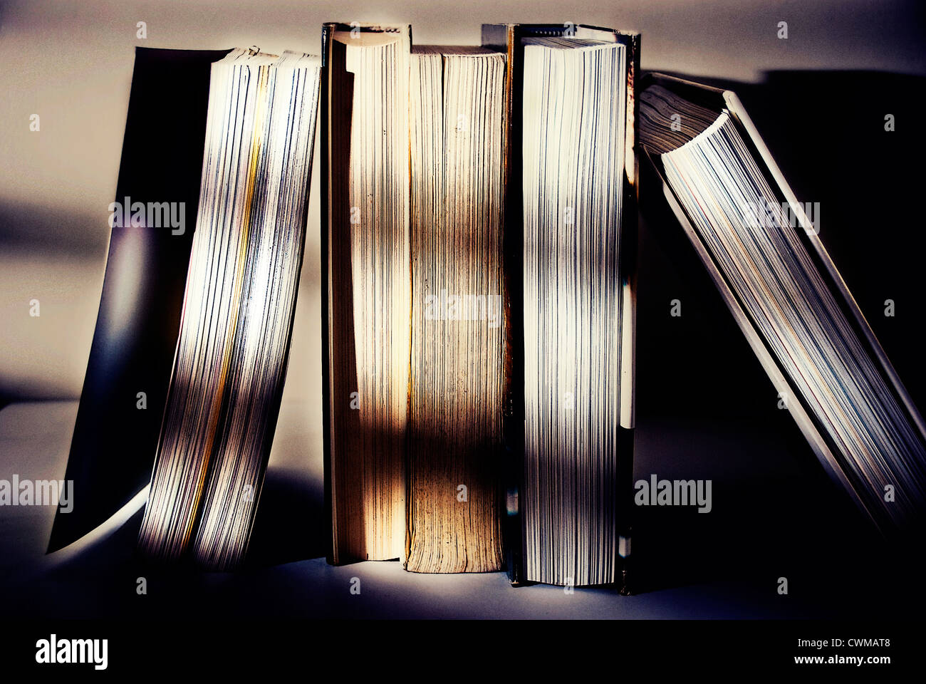 Heap of old books against white background Stock Photo - Alamy