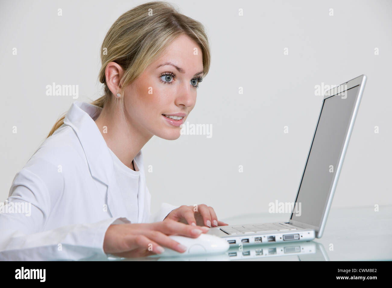 Medical secretary using laptop Stock Photo - Alamy