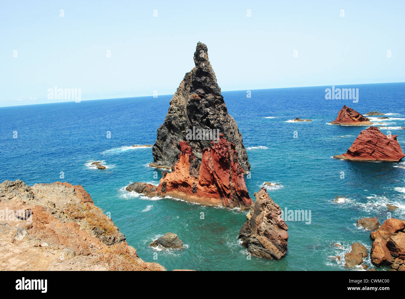 Picture of volcanic rocks in blue ocean Stock Photo - Alamy