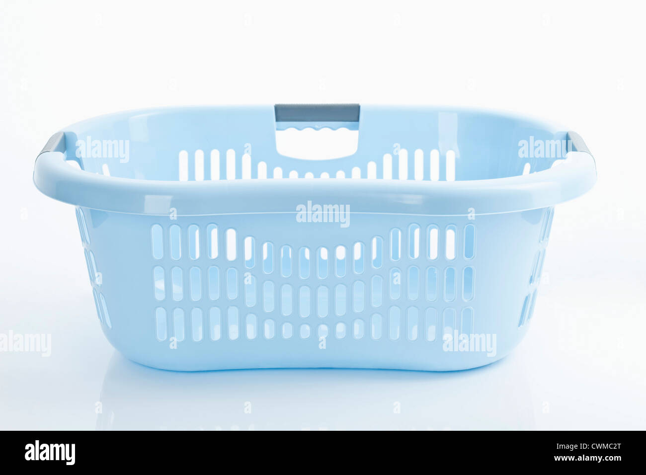 Laundry basket on white background Stock Photo - Alamy