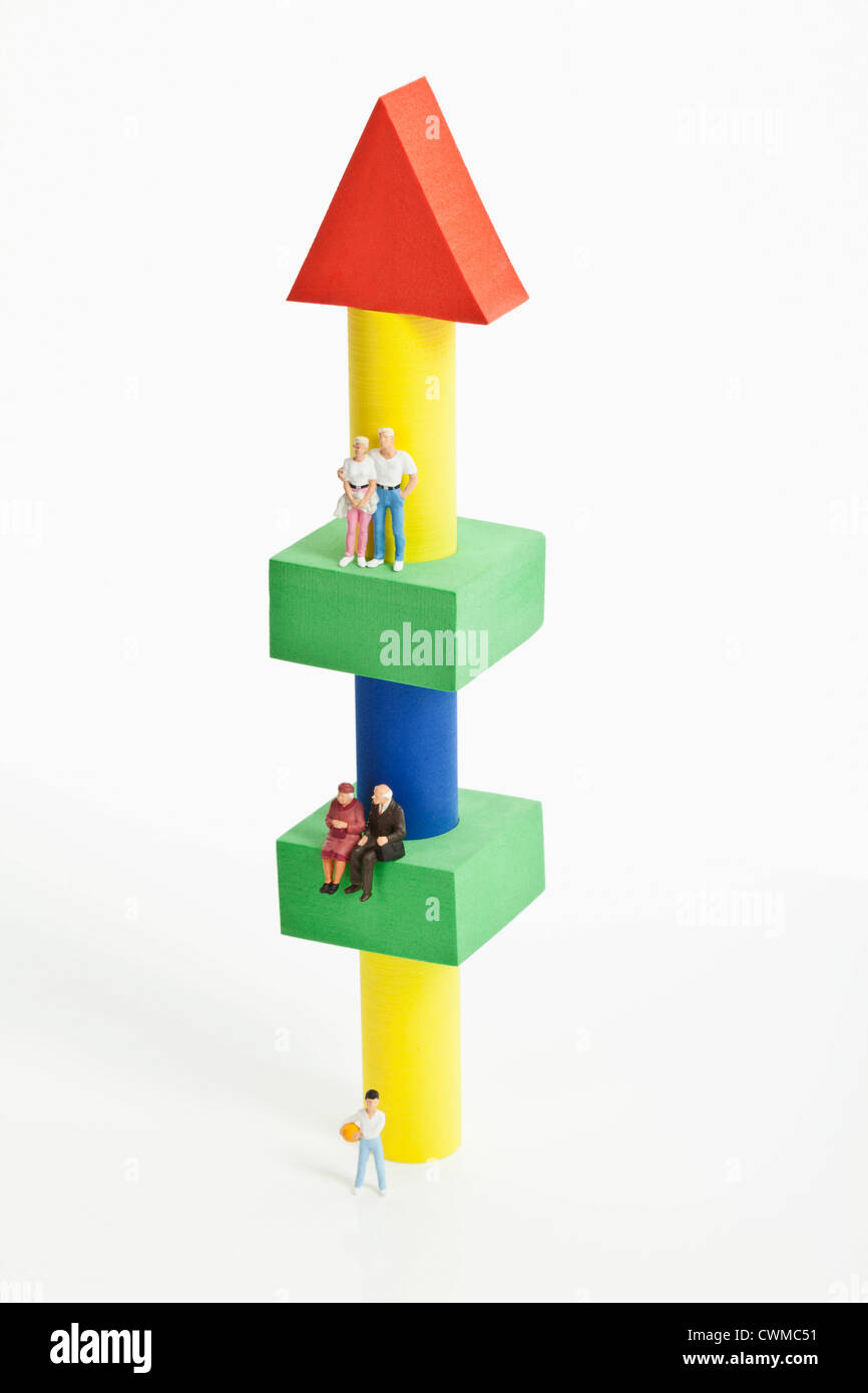 Figurines on block Stock Photo - Alamy
