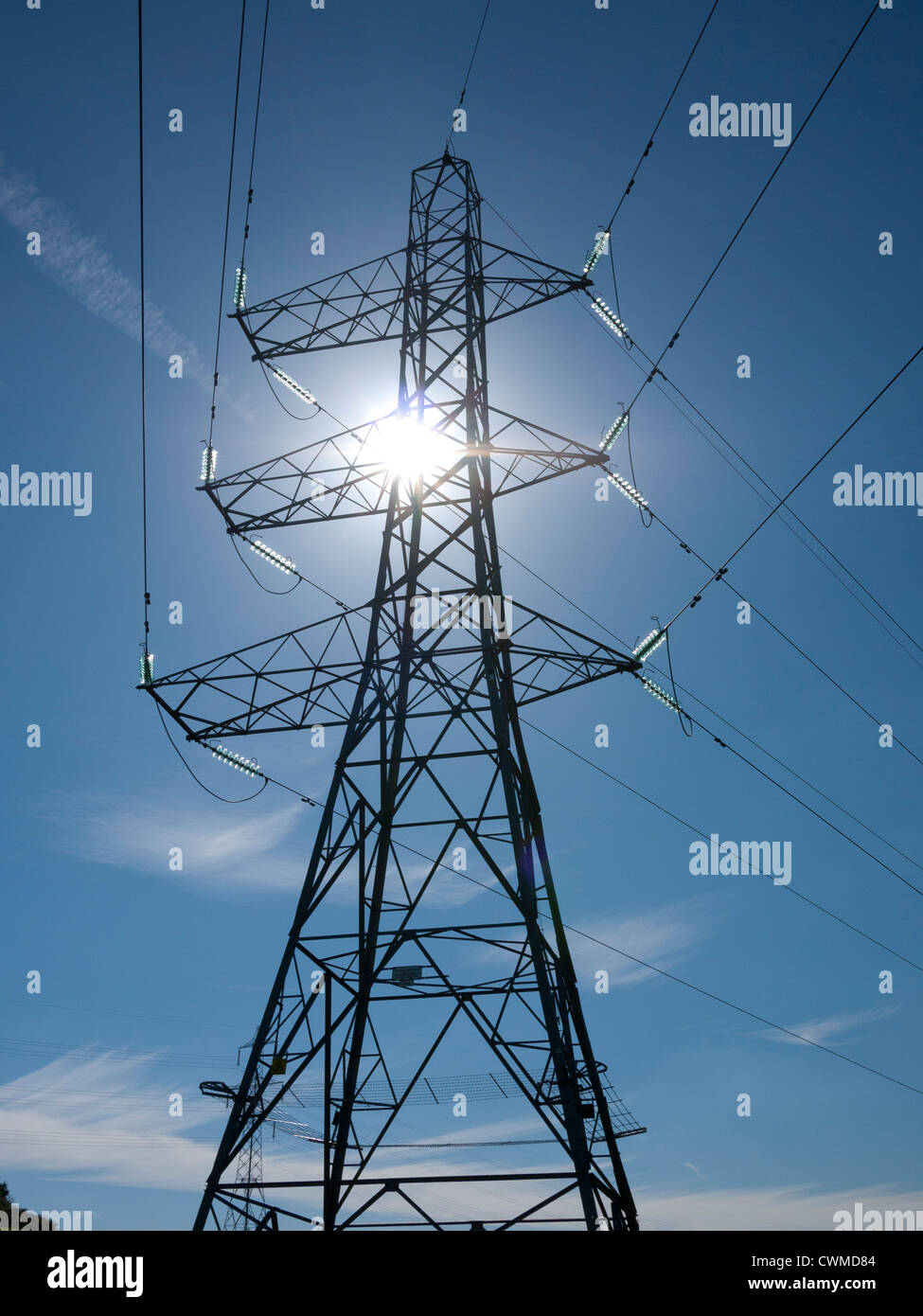 Electricity Pylon backlit with the sun. England, UK Stock Photo - Alamy