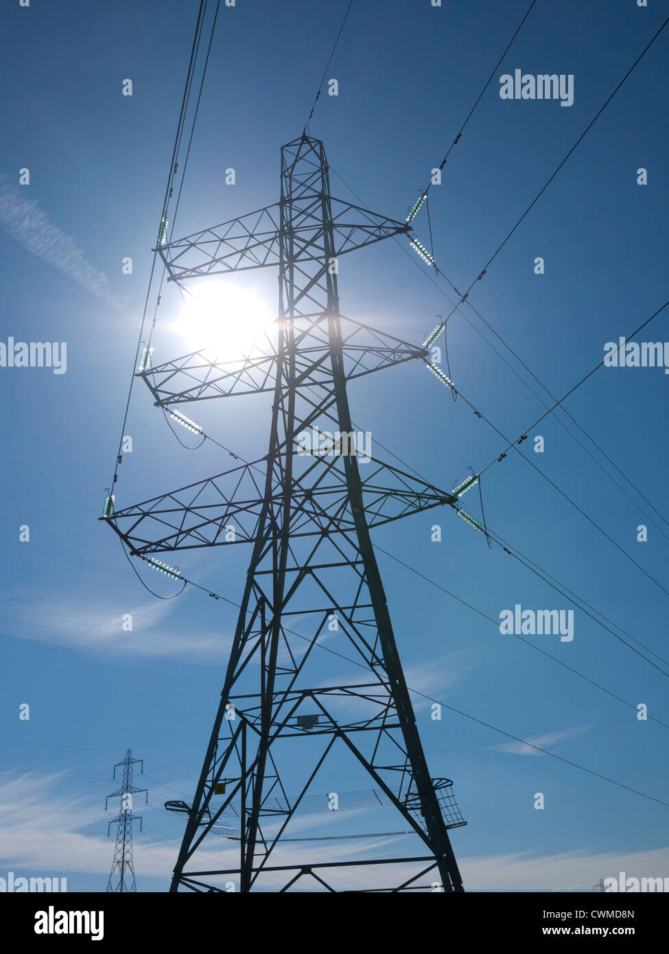 Electricity Pylon backlit with the sun. England, UK Stock Photo - Alamy