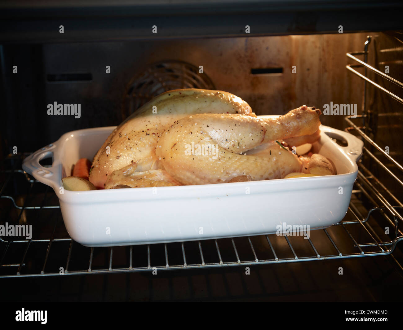 Germany, Cologne, Roast chicken in oven, close up Stock Photo - Alamy