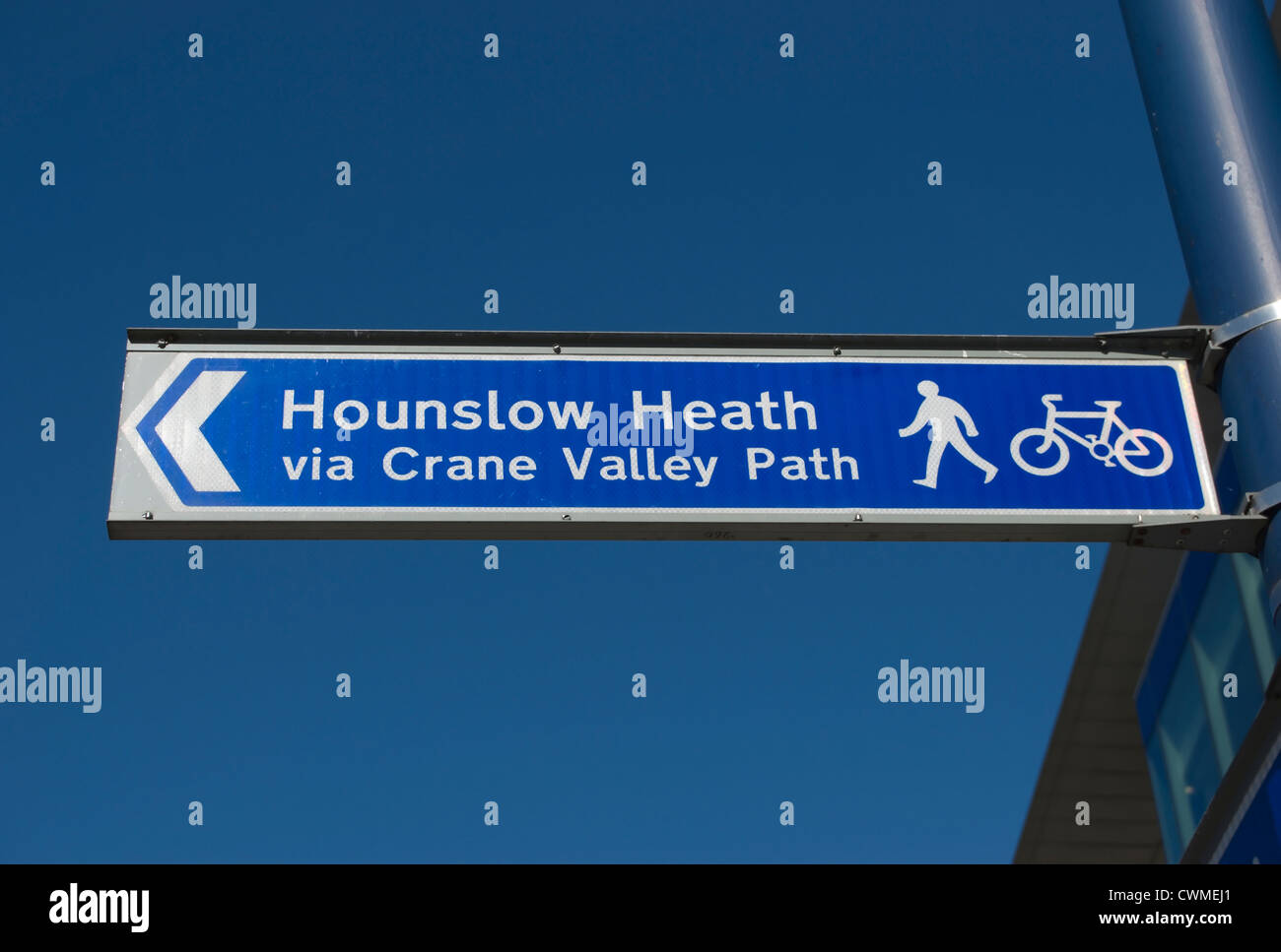 left pointing cycle and walking sign for hounslow heath via crane ...